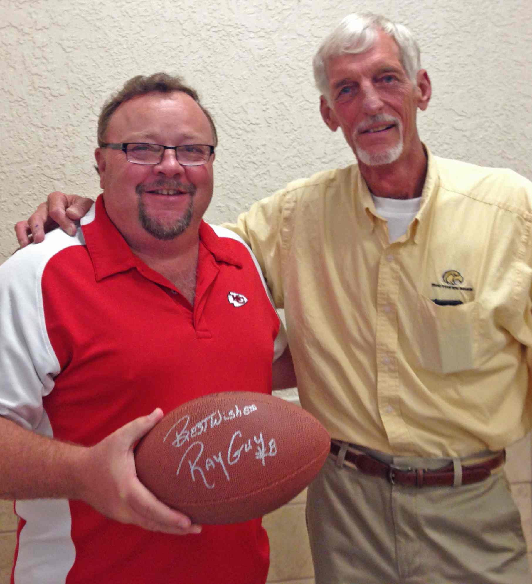 Villager Takes fair Catch On Football Autographed By Legendary NFL Villager Takes fair Catch On Football Autographed By Legendary NFL