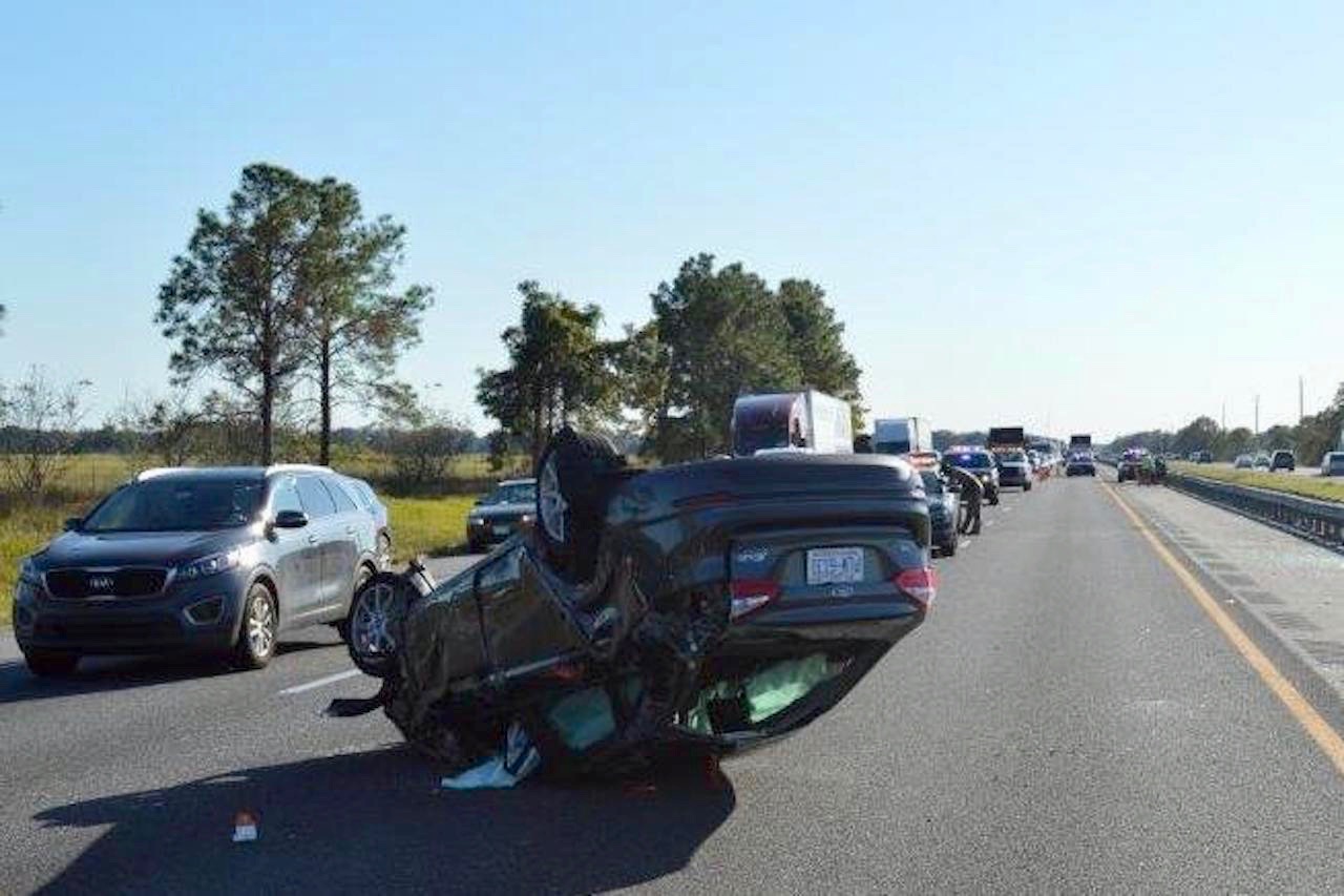 Vehicle overturns in near miss with unmarked FHP vehicle on I-75 in ...