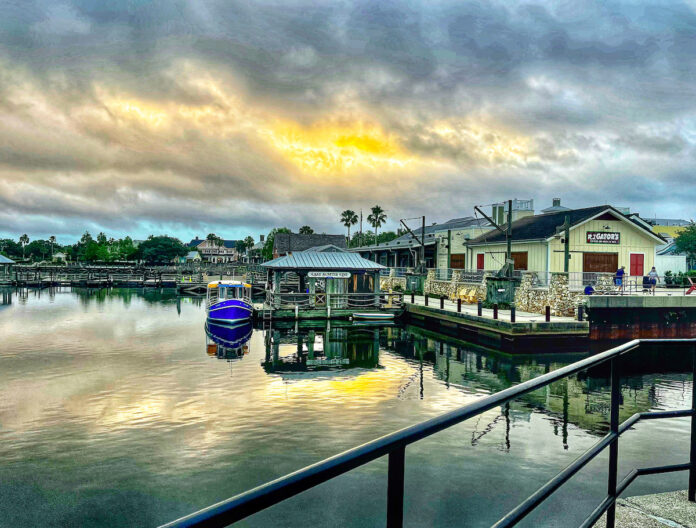 Morning sun peaking through clouds above Lake Sumter - Villages-News.com