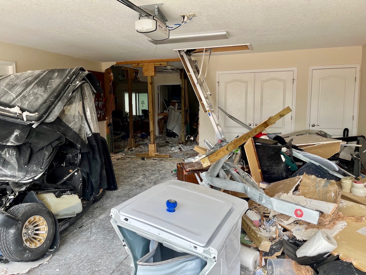 Driver suffering medical episode crashes through garage at home in The ...