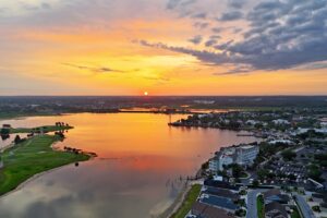 Drone shot of sunrise over Lake Sumter - Villages-News.com