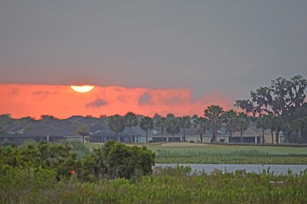 Fiery sunrise peeks over Riley Grove Course at Palmer Legends ...